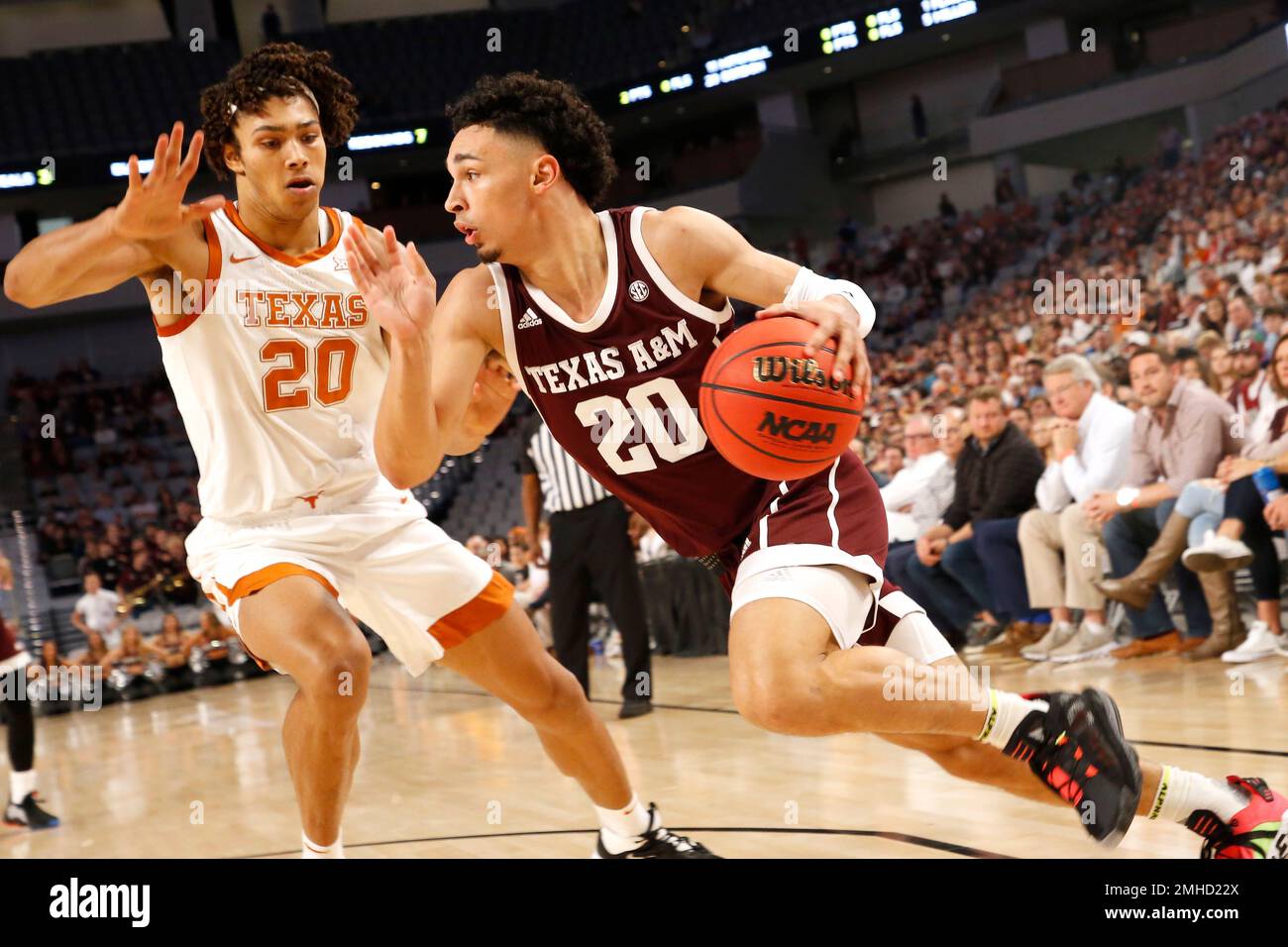Texas A&M guard Andre Gordon (20) drives inside as Texas forward ...
