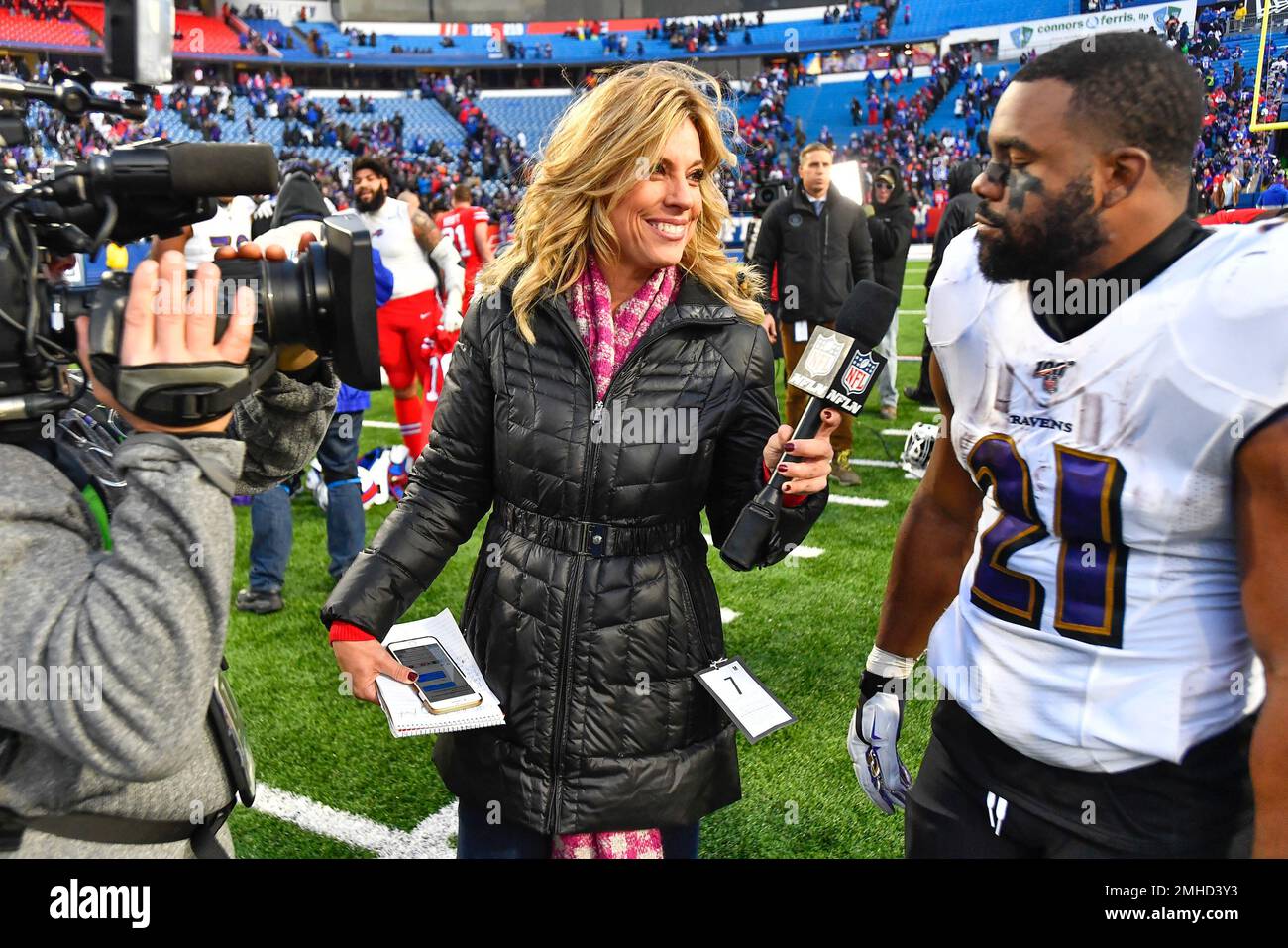 NFLN reporter Kim Jones interviews Baltimore Ravens running back Mark ...