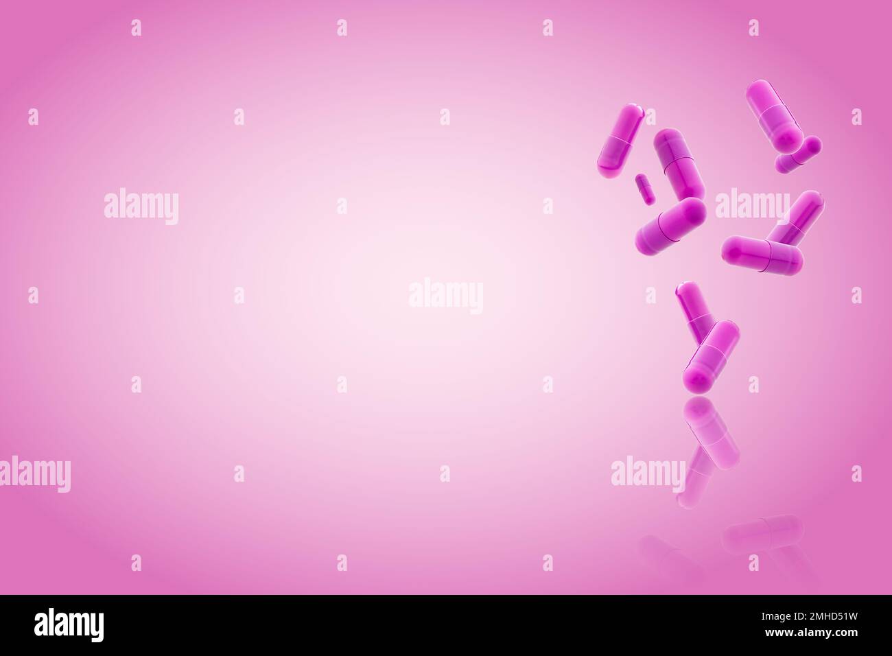 pink medical gel capsules falling down on pink background. food ...