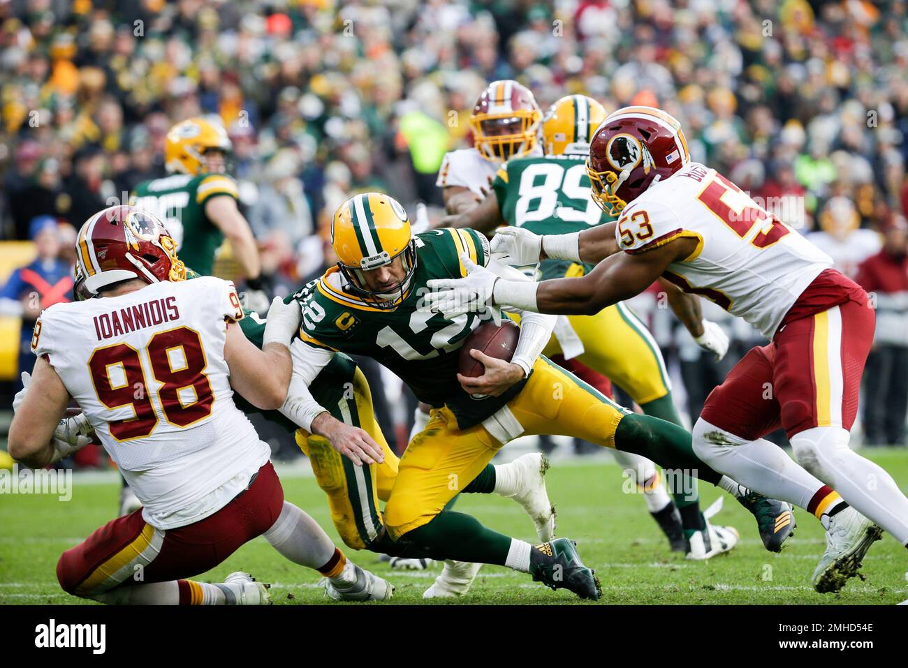 Green Bay Packers' Aaron Rodgers is sacked by Washington Redskins' Jon ...
