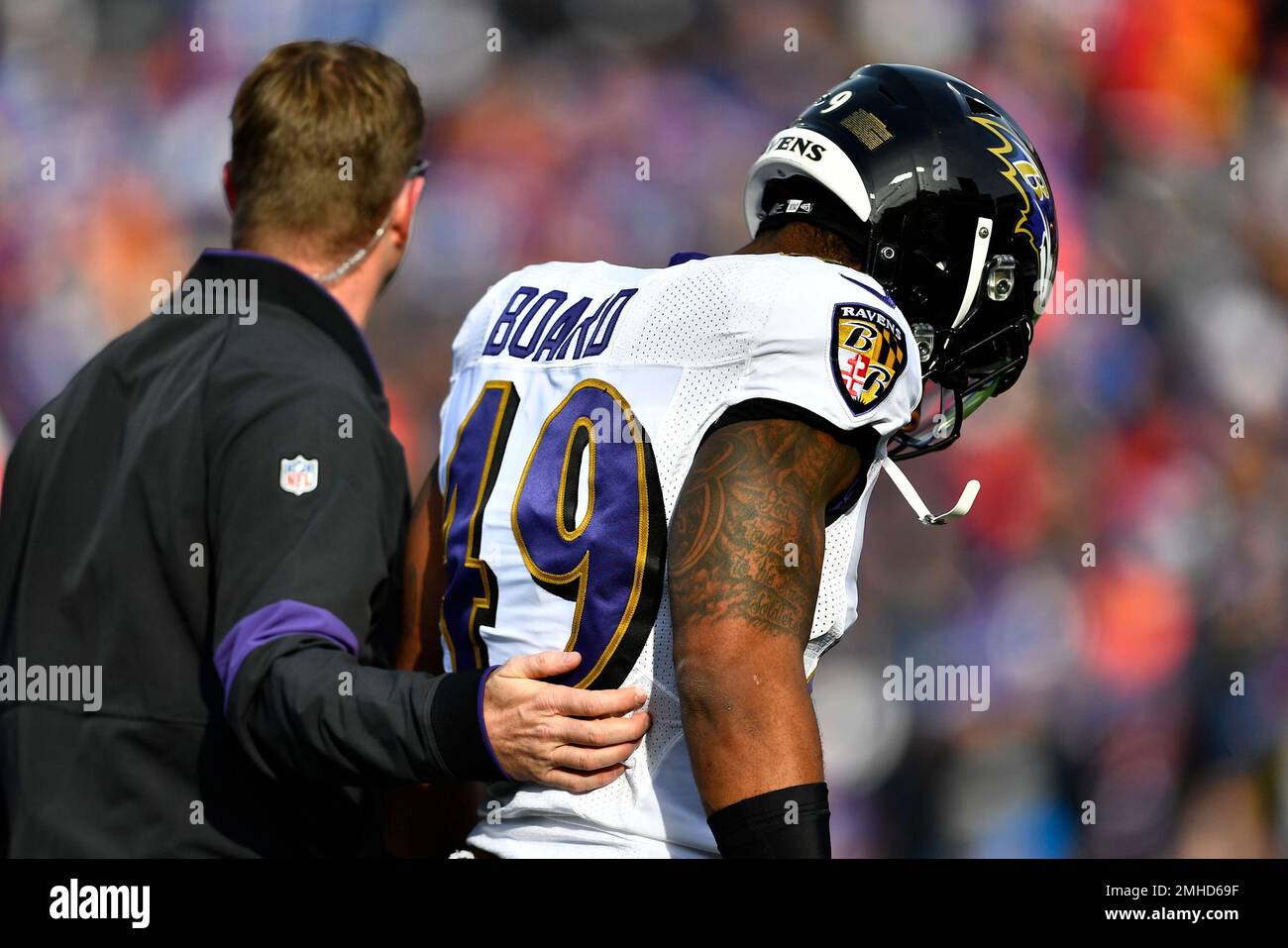 Baltimore Ravens linebacker Chris Board (49) is helped off the field ...