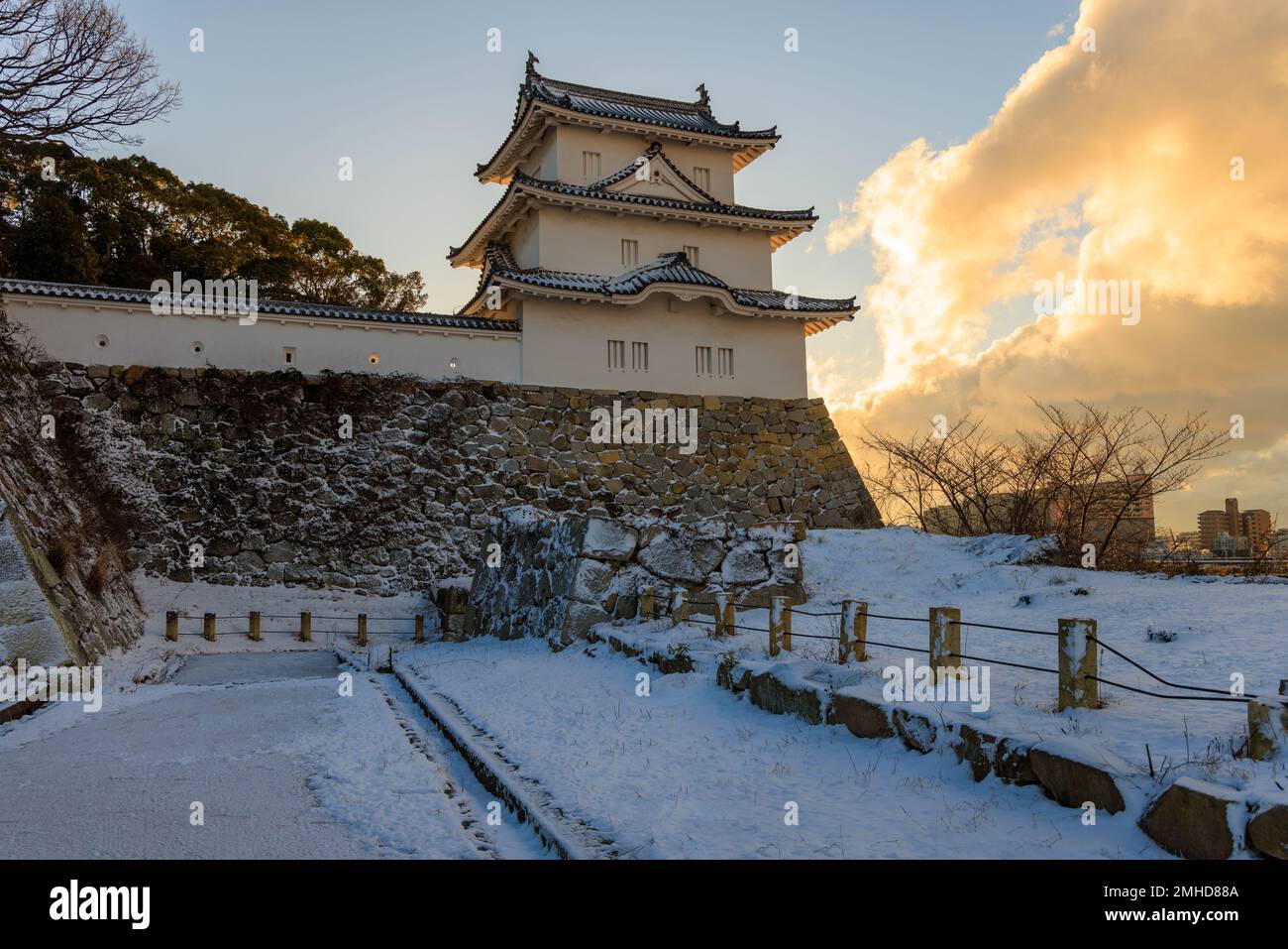 Akashi Castle tower and stone walls in snowy landscape at sunrise Stock ...