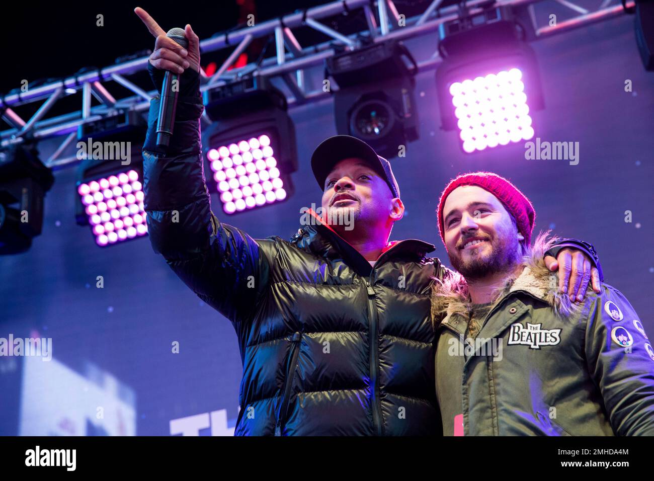 Will Smith rallies the crowd for Josh Littlejohn, right, founder of The ...