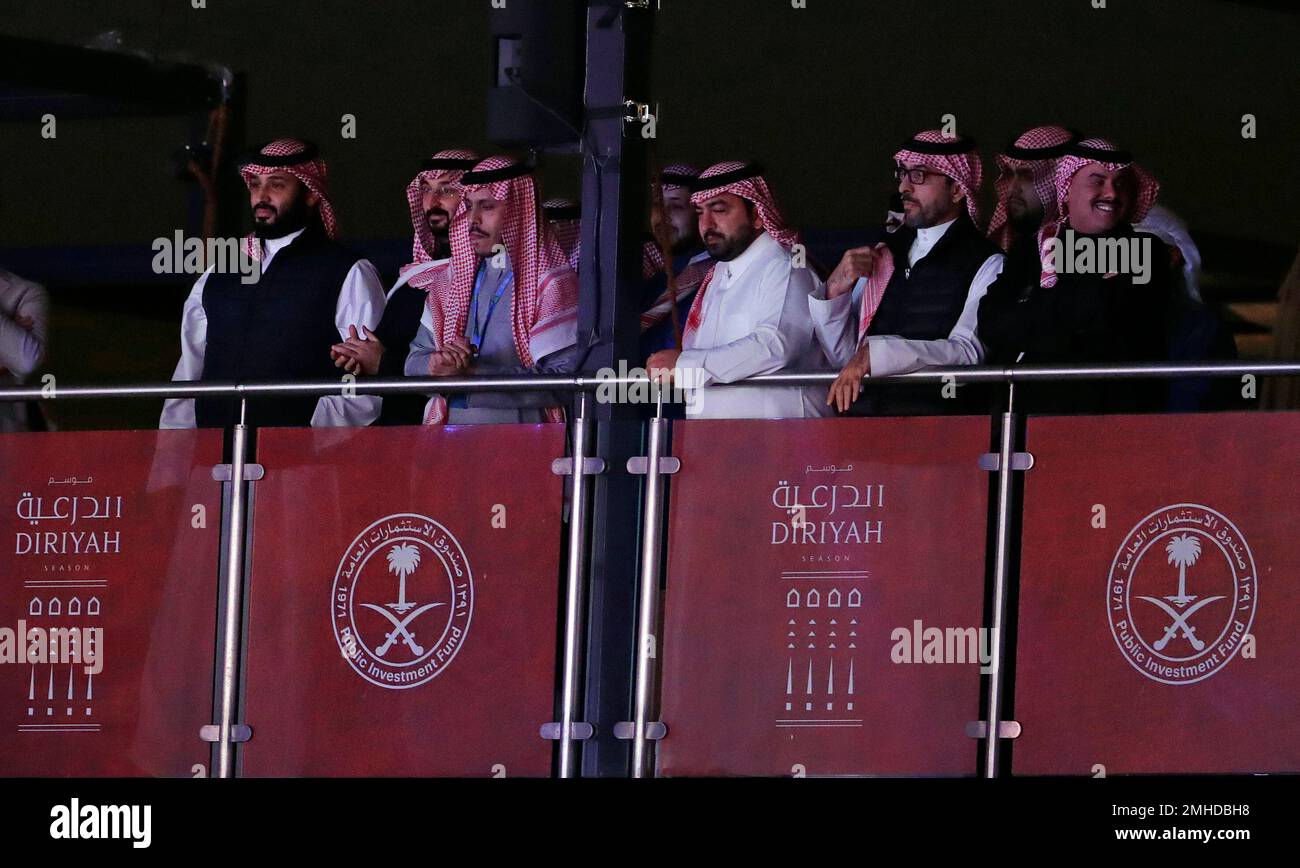 Saudi Crown Prince Mohammed bin Salman, left, watches as defending ...