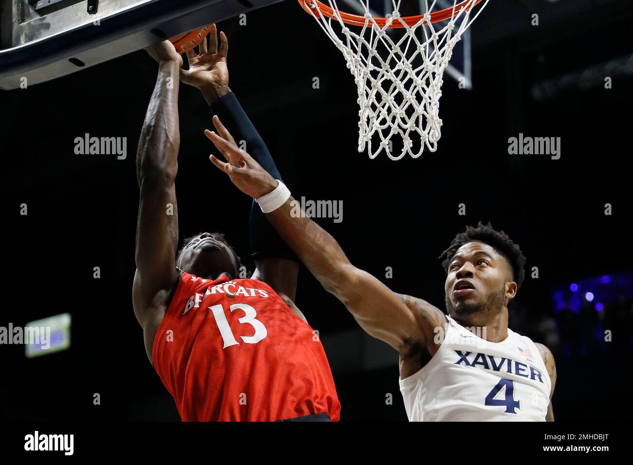 Cincinnati's Jeremiah Davenport (1) shoots against Xavier's Tyrique ...