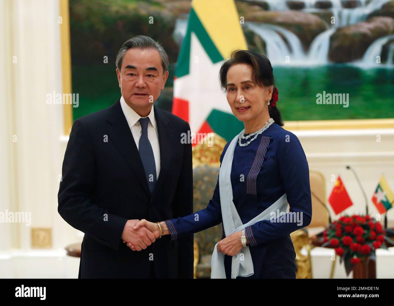 Myanmar's leader Aung San Suu Kyi, right, shakes hands with Chinese ...