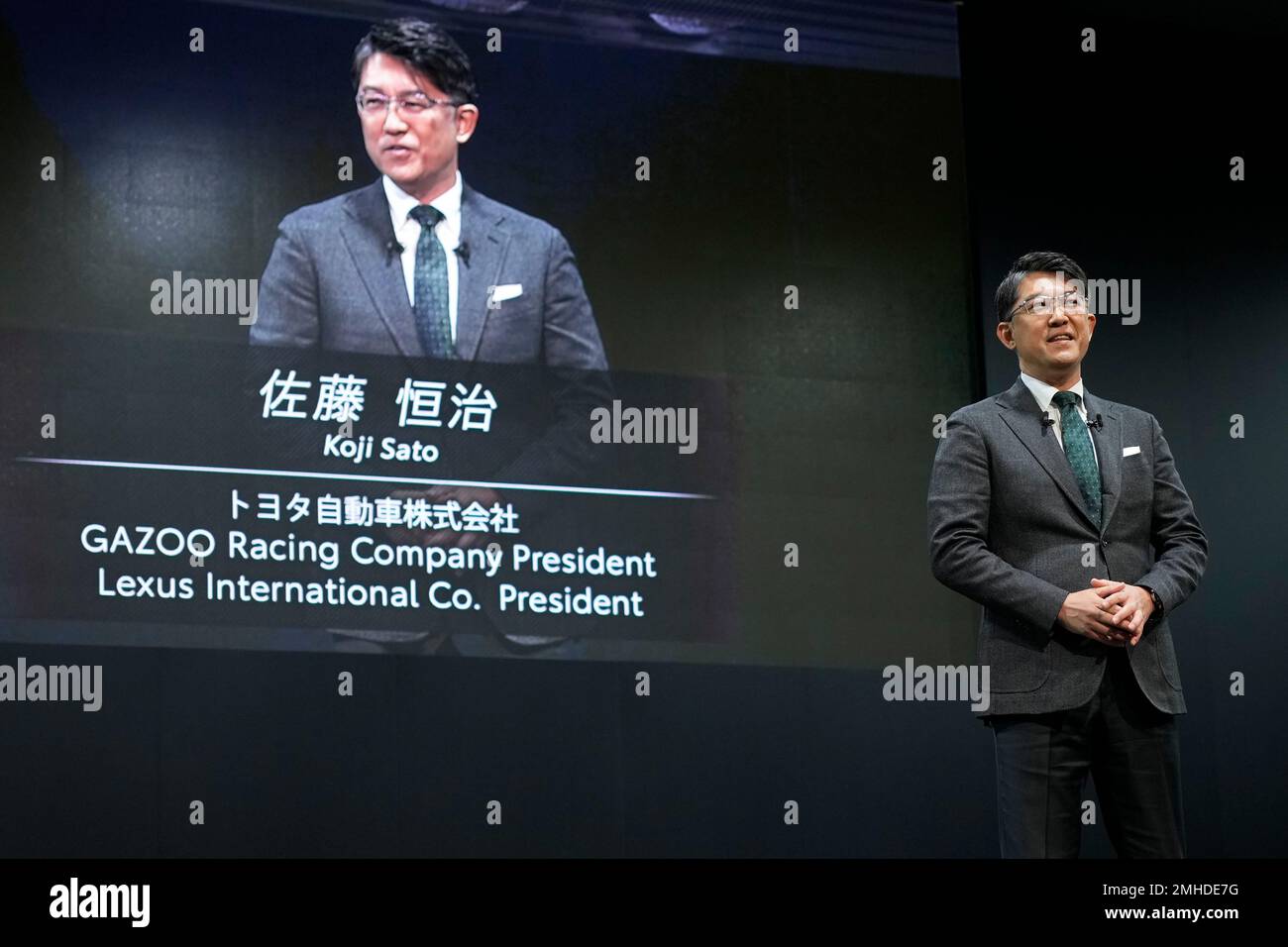 Koji Sato, Toyota Gazoo Racing Company president, poses on the stage at ...