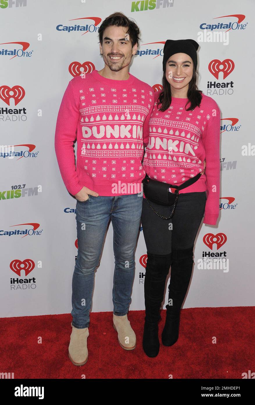 Jared Haibon, left, and Ashley Iaconetti arrive at Jingle Ball on ...