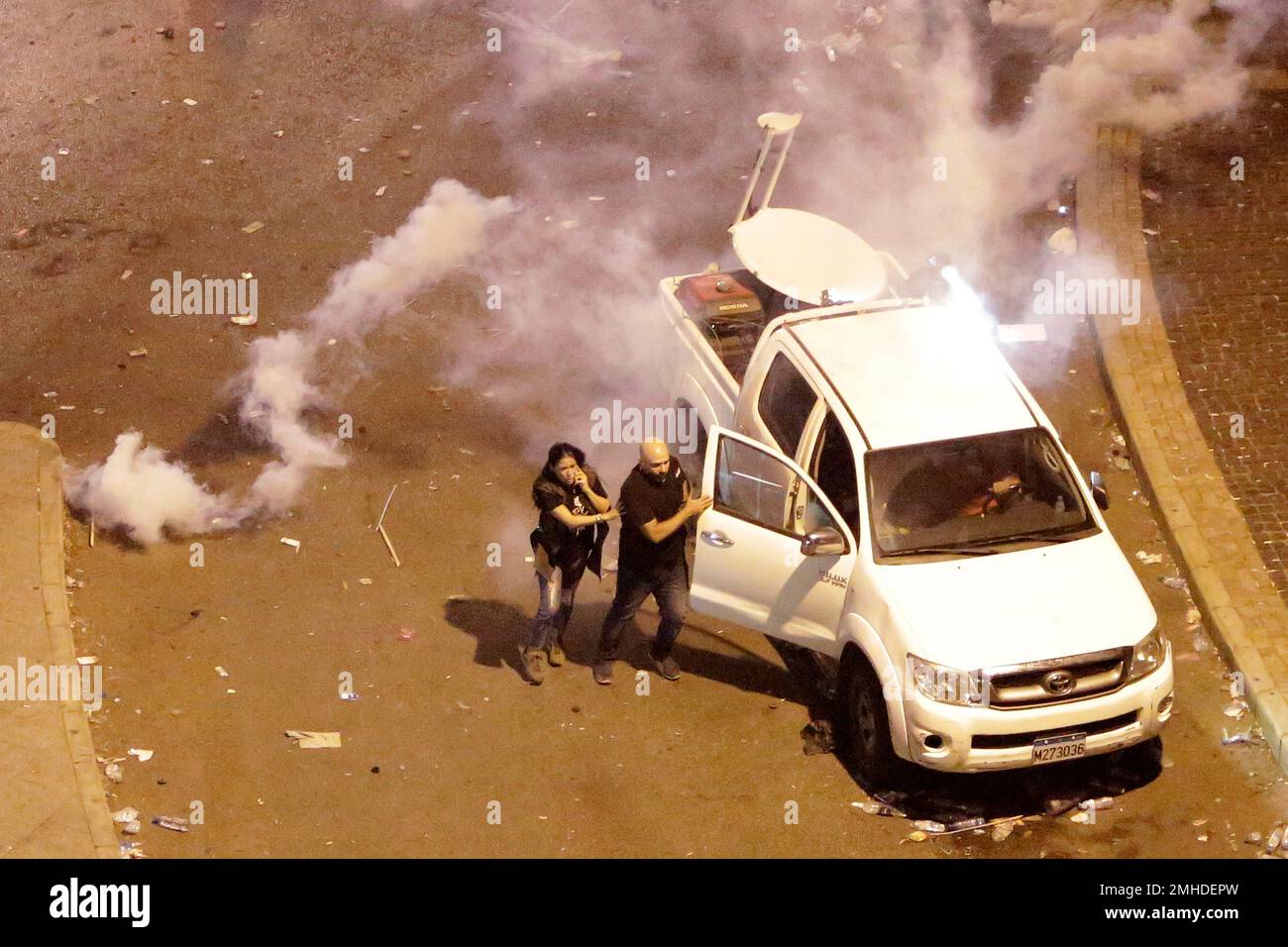 In this Friday Oct. 18, 2019 photo, Lebanese reporter Joyce Akiki, left ...