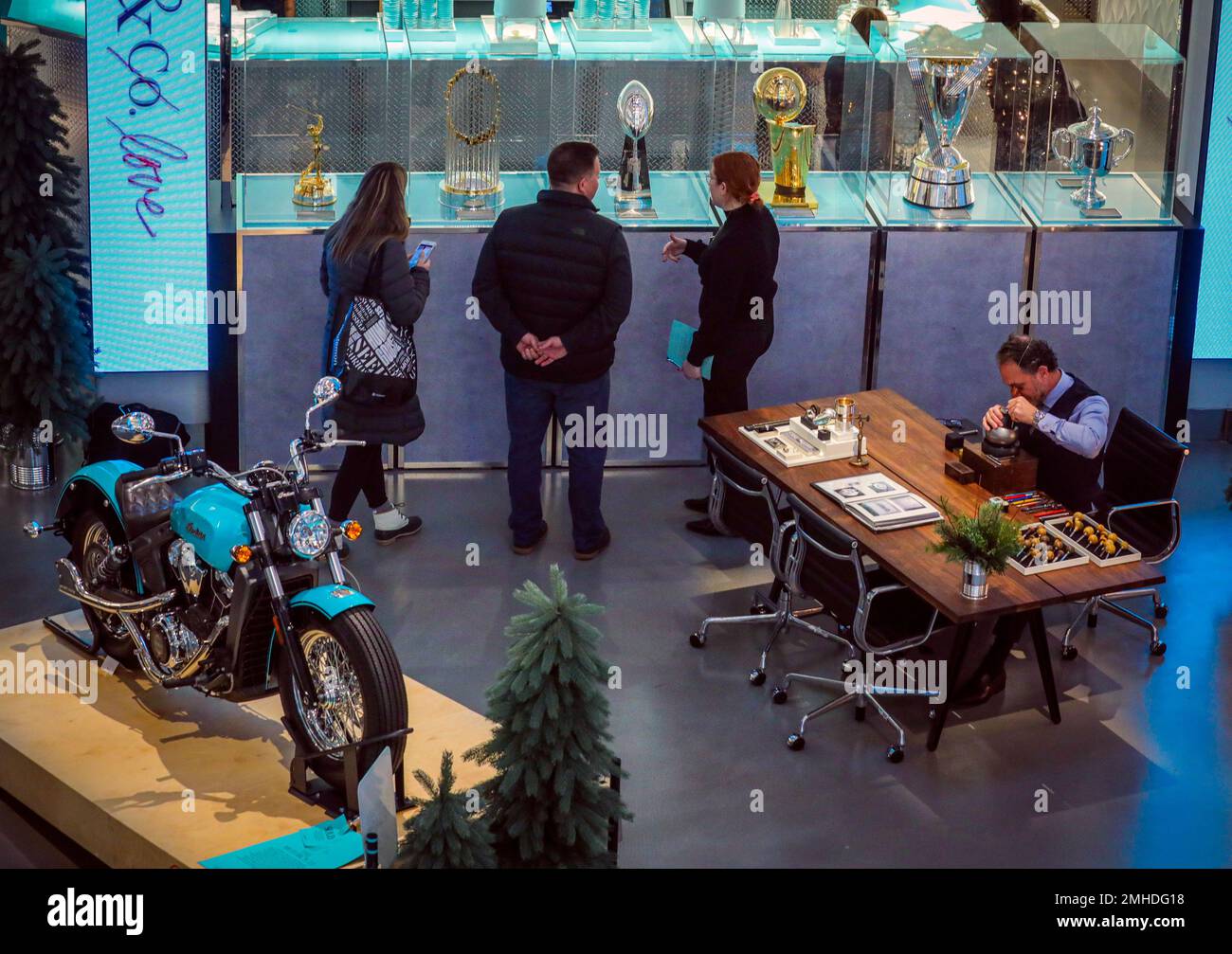 Tiffany & Co. master engraver, Timothy Murphy, far right, works at his ...