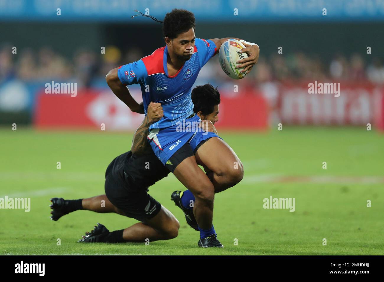 Samoa's Phillip Luki is tackled New Zealand's Regan Ware during a match ...