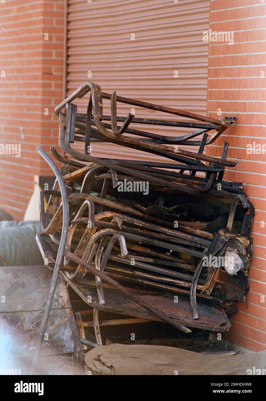 Discarded bus seats sit against a wall at the National Guard Armory in ...