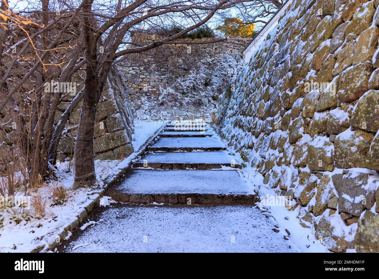 Snow covered stairs through ancient stone castle walls Stock Photo - Alamy