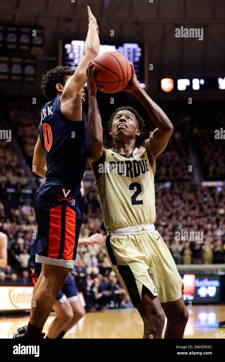 Purdue guard Eric Hunter Jr. (2) shoots over Virginia guard Kihei Clark ...