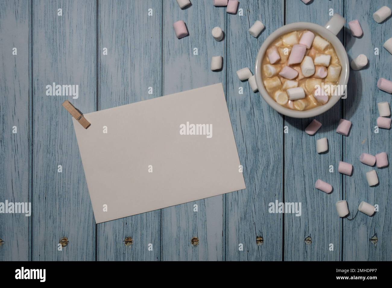 Empty greeting or invitation card mock up with white cup of coffee and ...