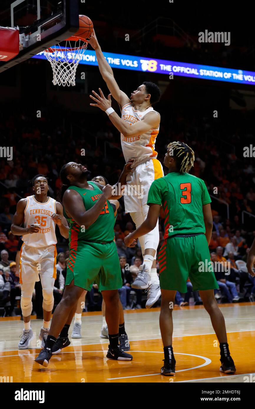 Tennessee forward Olivier Nkamhoua (21) dunks over Florida A&M center ...
