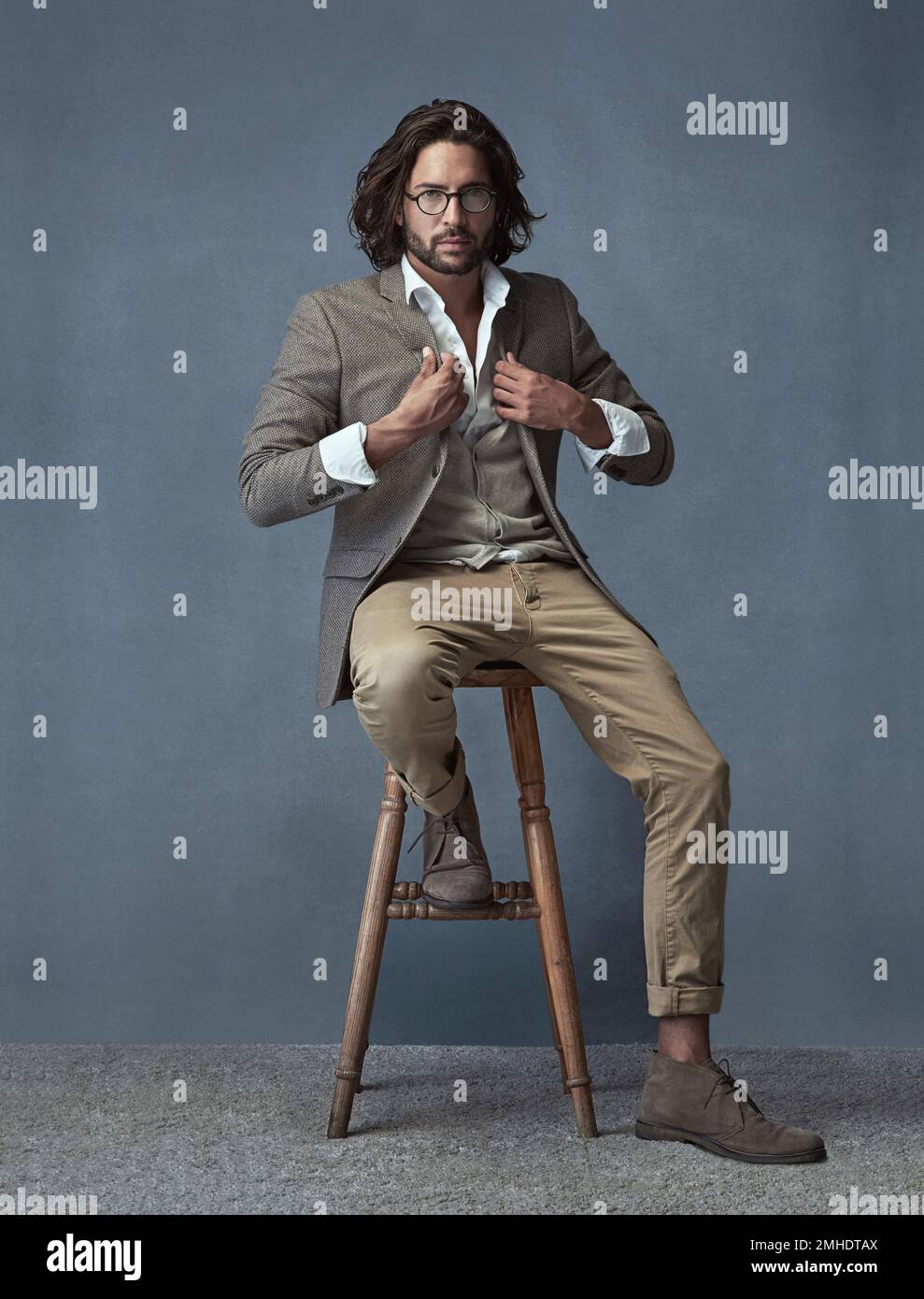 Handsome stylish man sitting hi-res stock photography and images - Alamy
