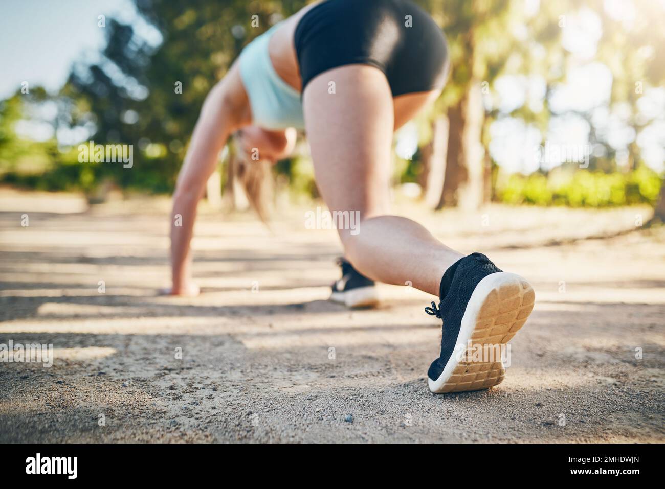 Great legs takes great effort. a young woman getting ready for a run ...