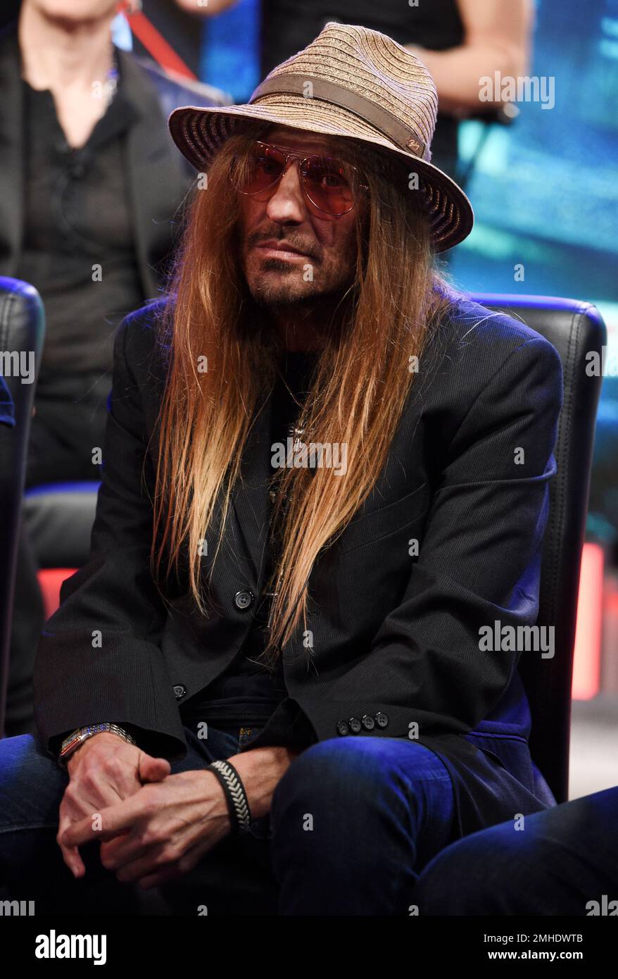 C.C. DeVille of Poison looks on during a news conference to announce ...