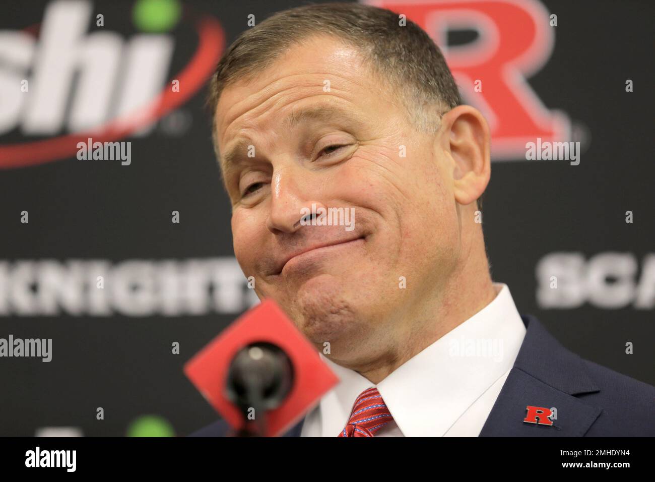 New Rutgers football coach Greg Schiano speaks at an introductory news ...