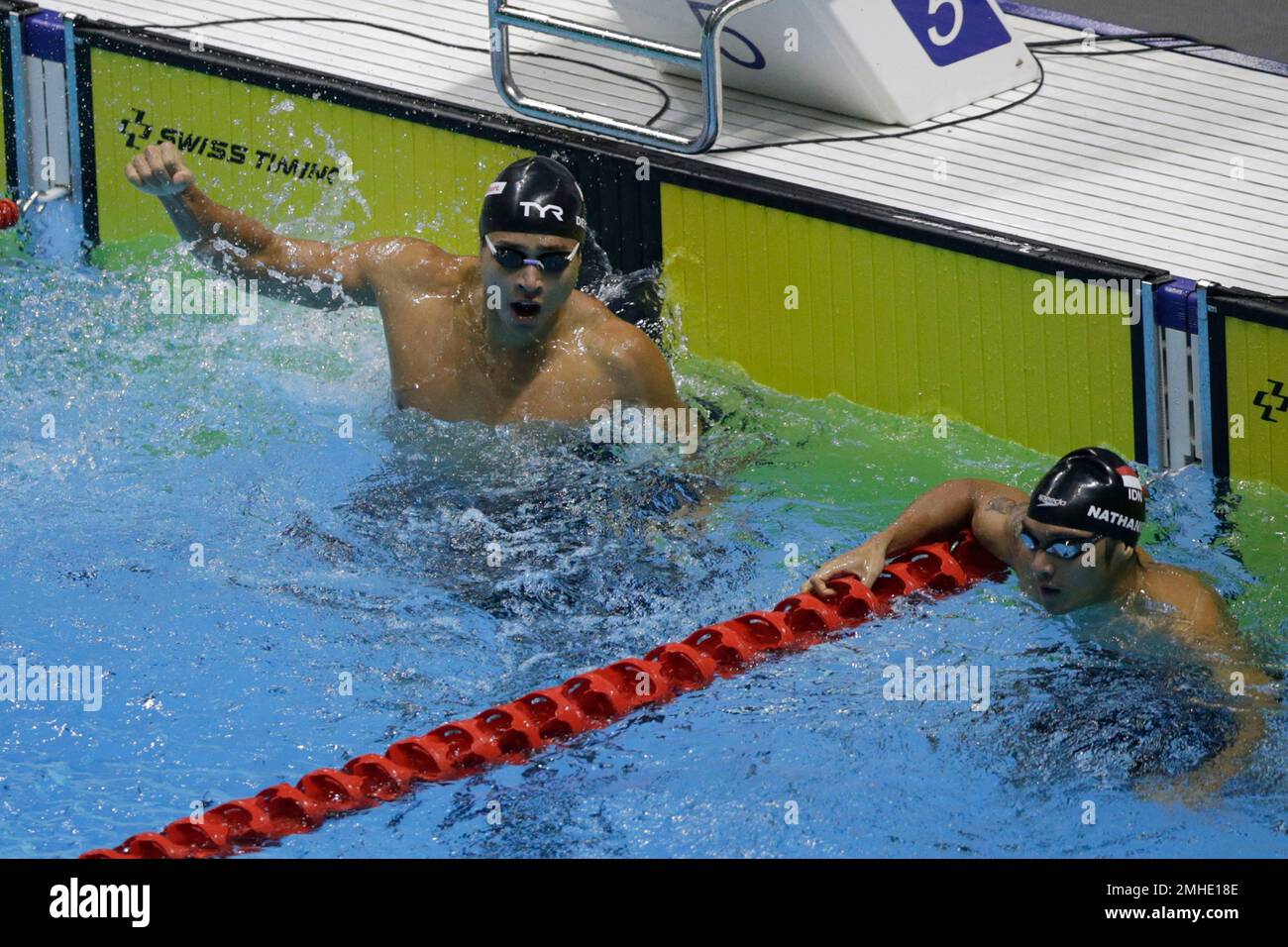 Philippine's Deiparine James, left, reacts after winning in the men's ...