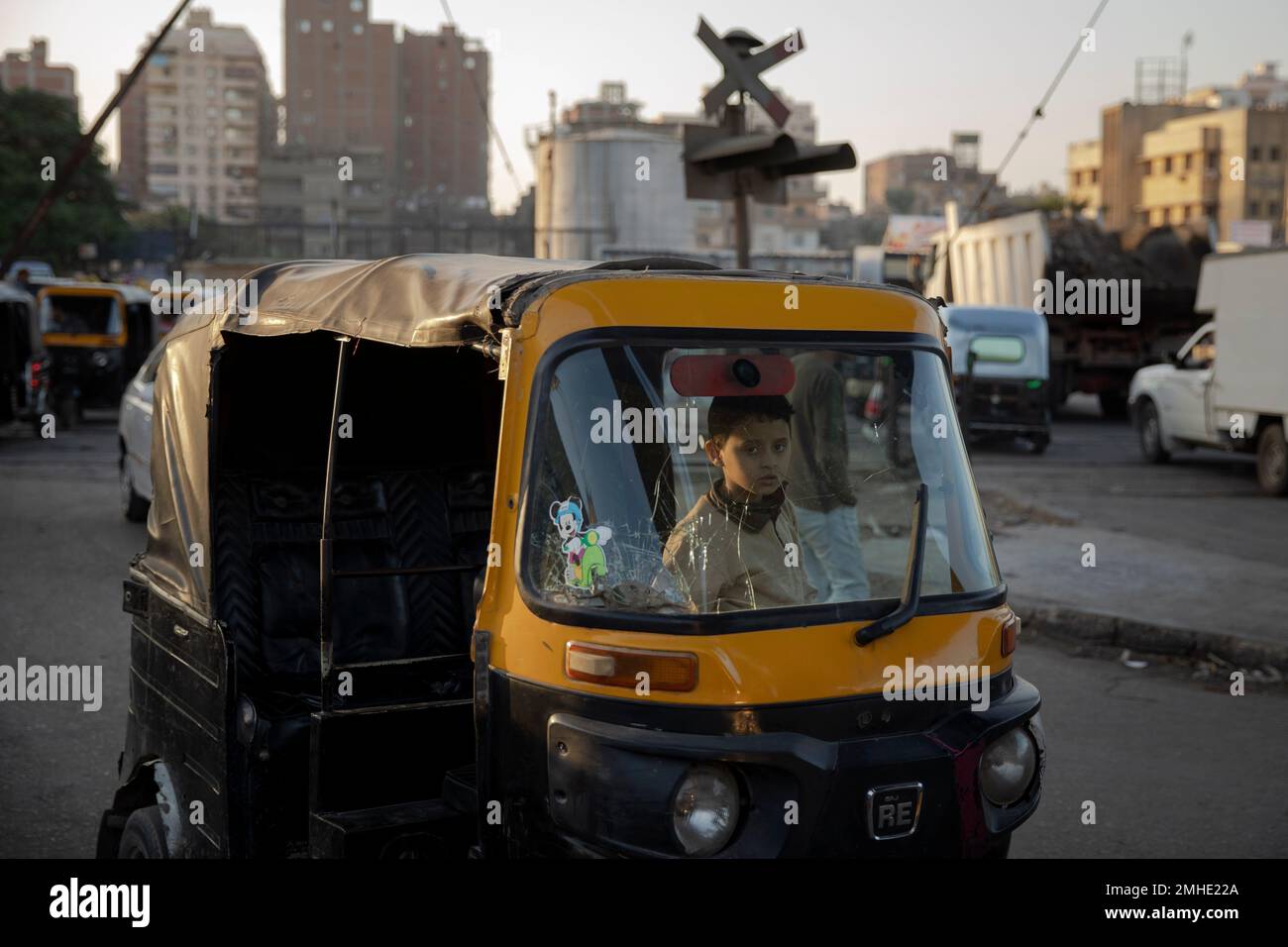In this Nov. 19, 2019 photo, a boy sits in the driver's seat of a tuk ...