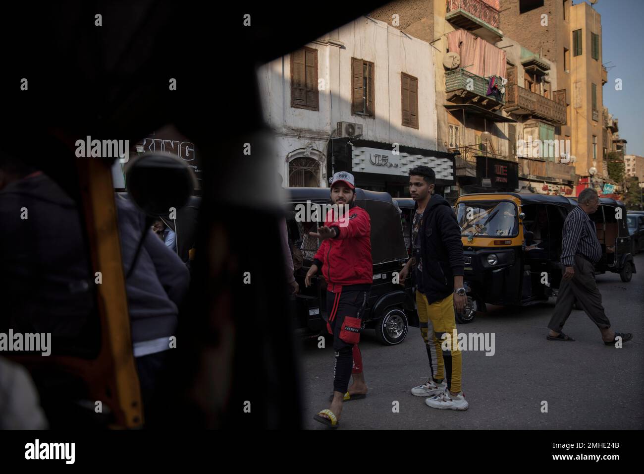In this Nov. 19, 2019 photo, citizens help tuk-tuk drivers maneuver in ...