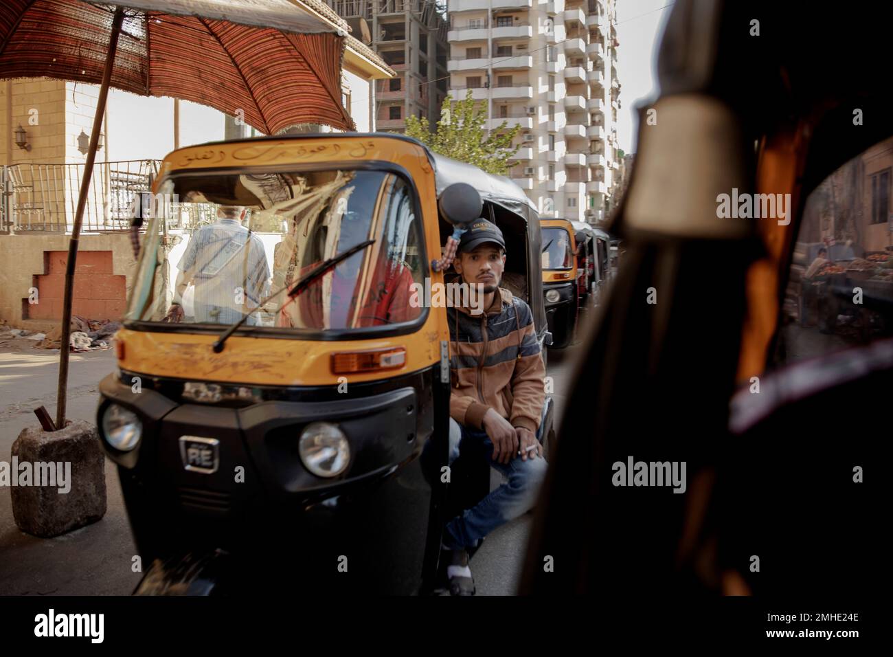 In this Nov. 19, 2019 photo, tuk-tuk drivers make their way with ...