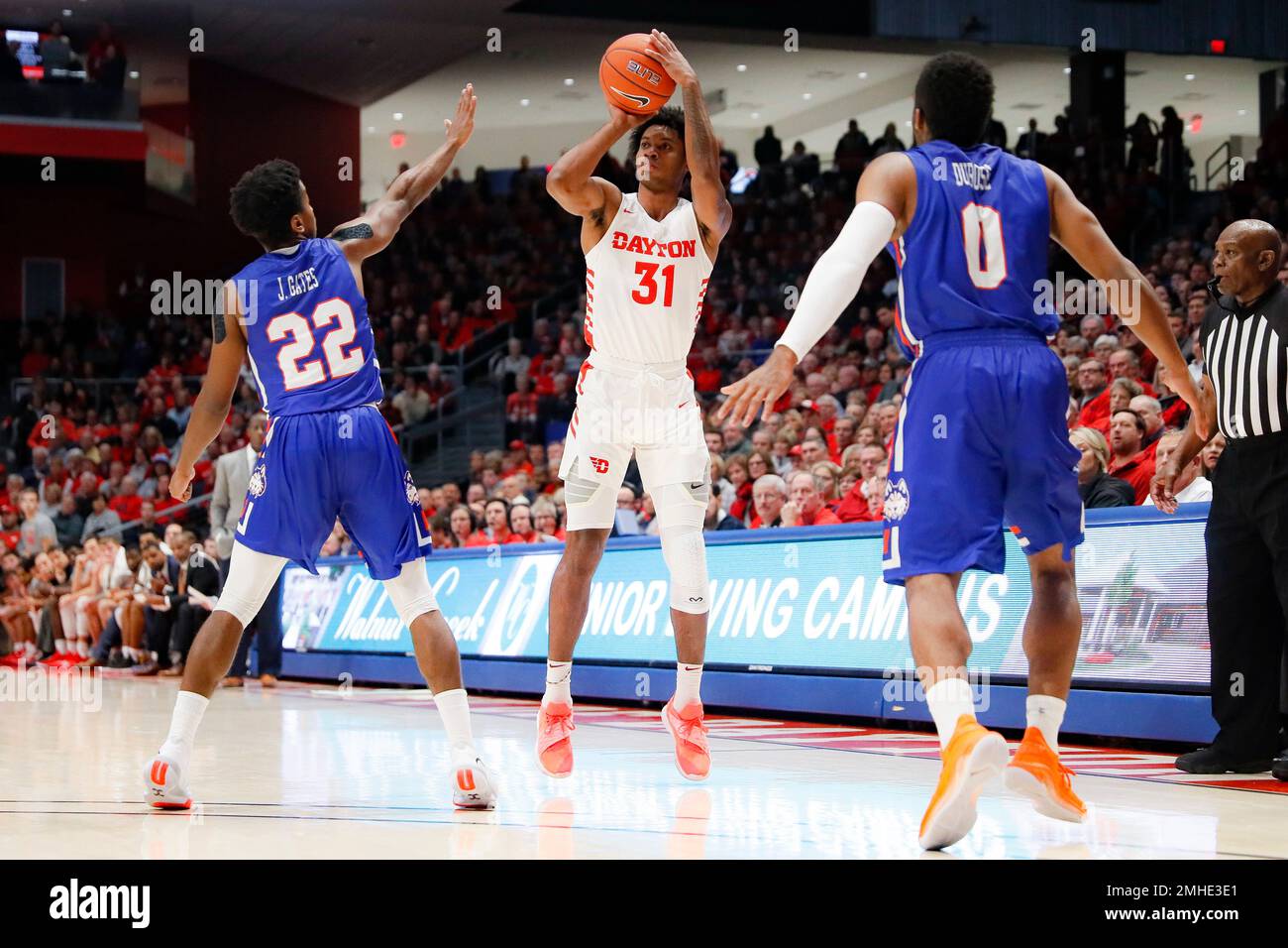 Dayton's Jhery Matos (31) shoots over Houston Baptist's Jalon Gates (22 ...