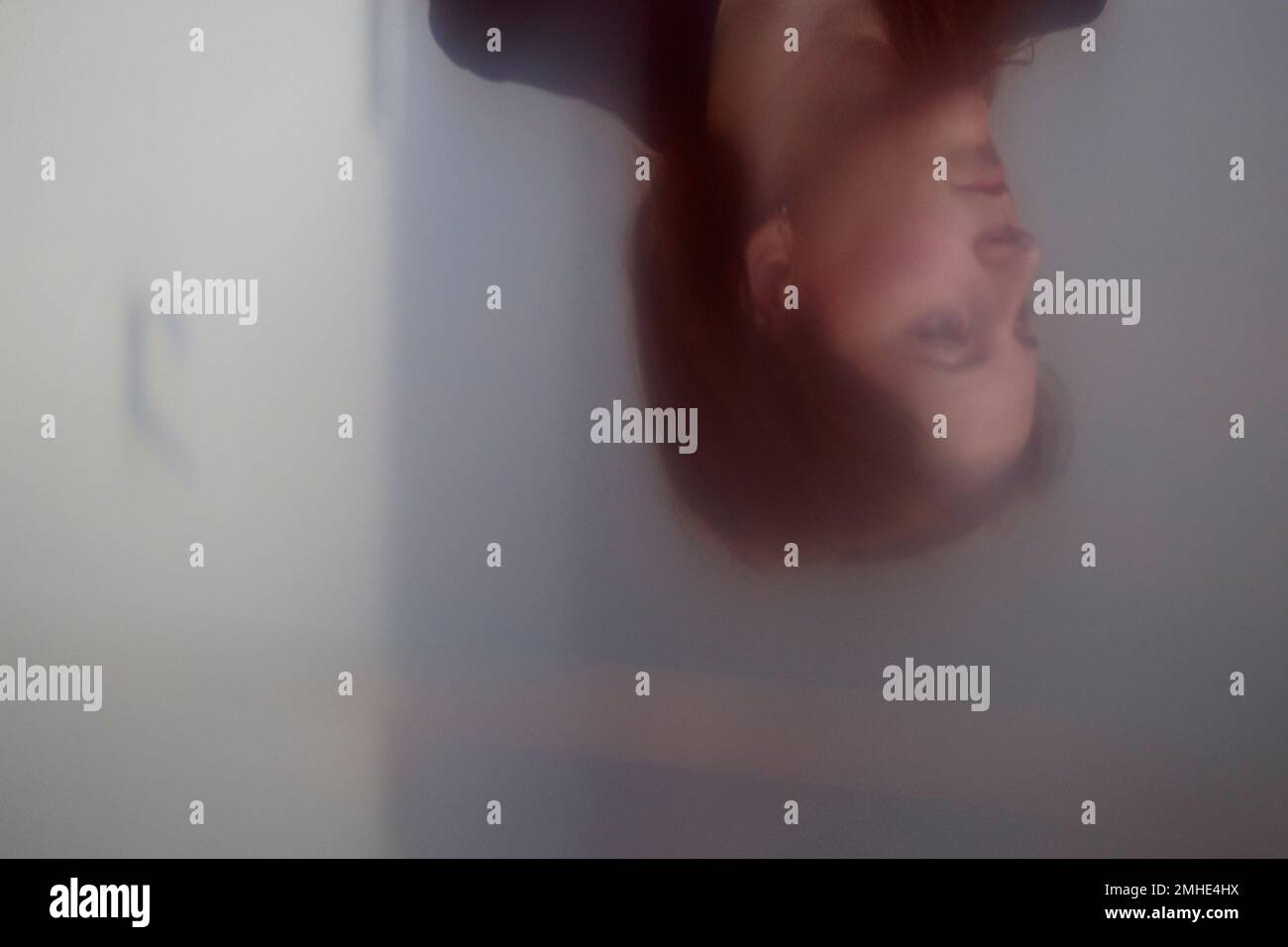 Reflected in a conference table, Sarah Moriarty, the daughter of Robert ...