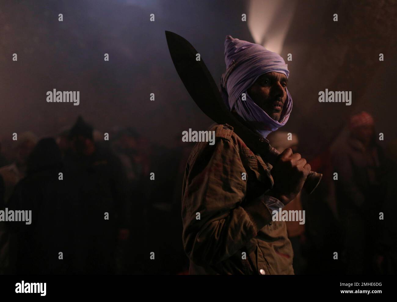 A butcher gets ready to sacrifice animals during Gadhimai festival in ...