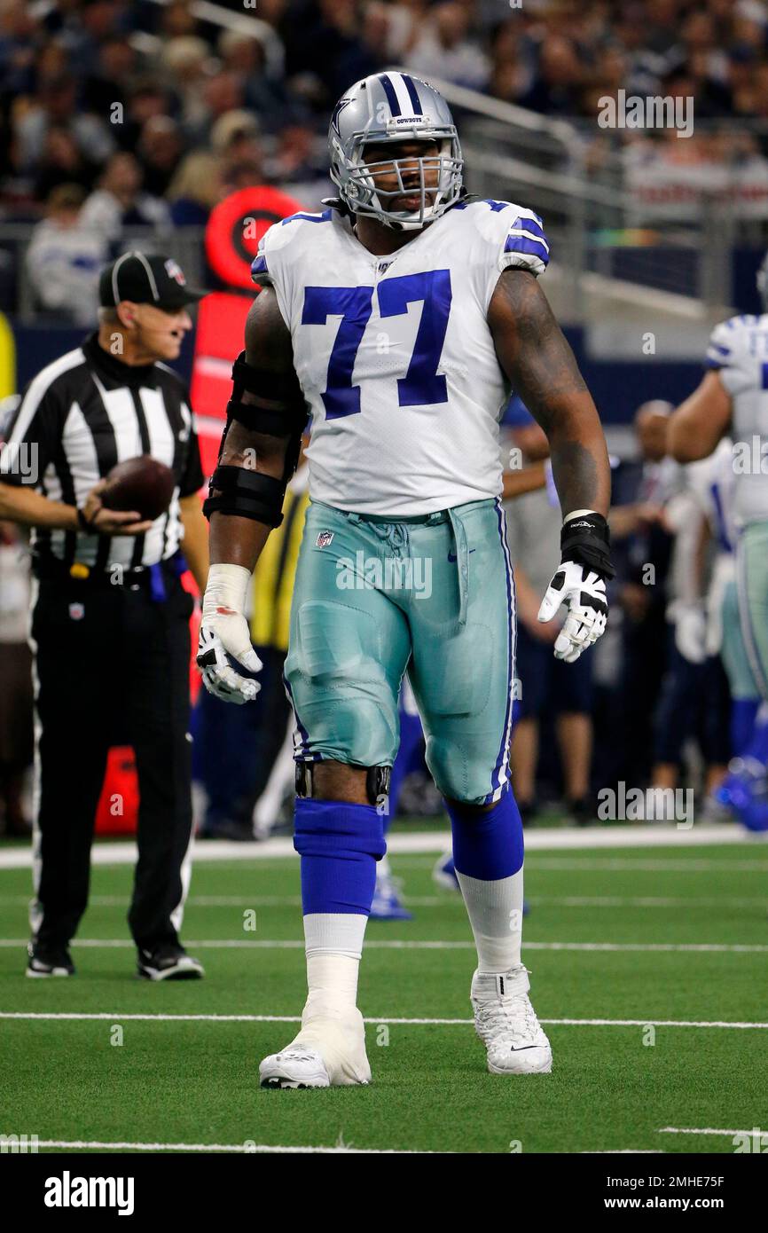Dallas Cowboys offensive tackle Tyron Smith (77) walks up to the line ...