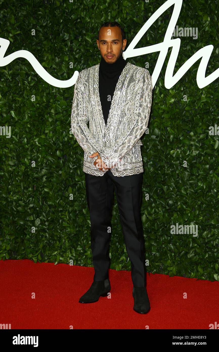 Lewis Hamilton poses for photographers upon arrival at the British ...