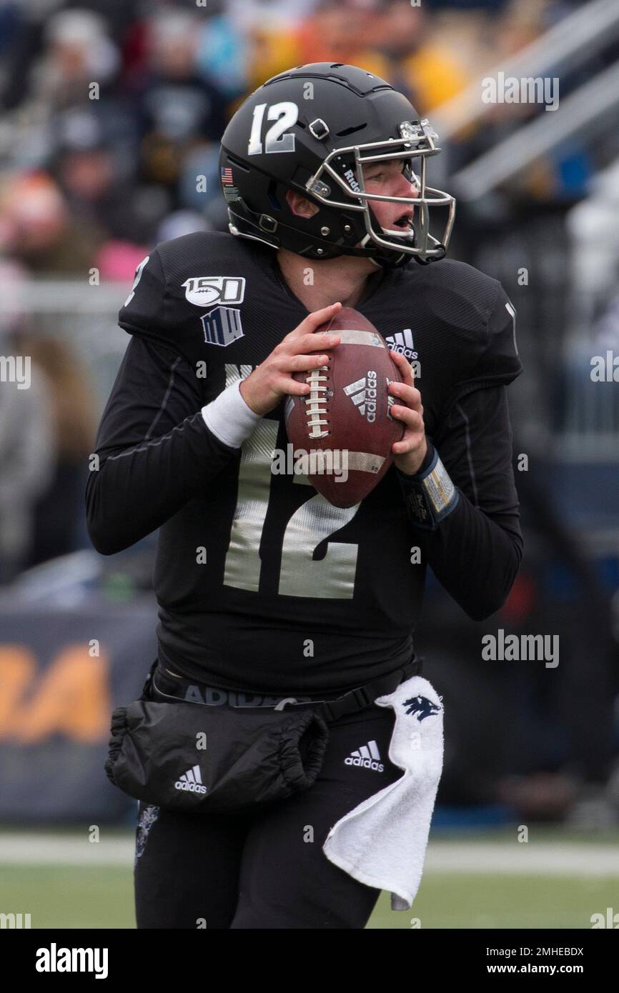 Nevada quarterback Carson Strong (12) drops back to pass against UNLV ...