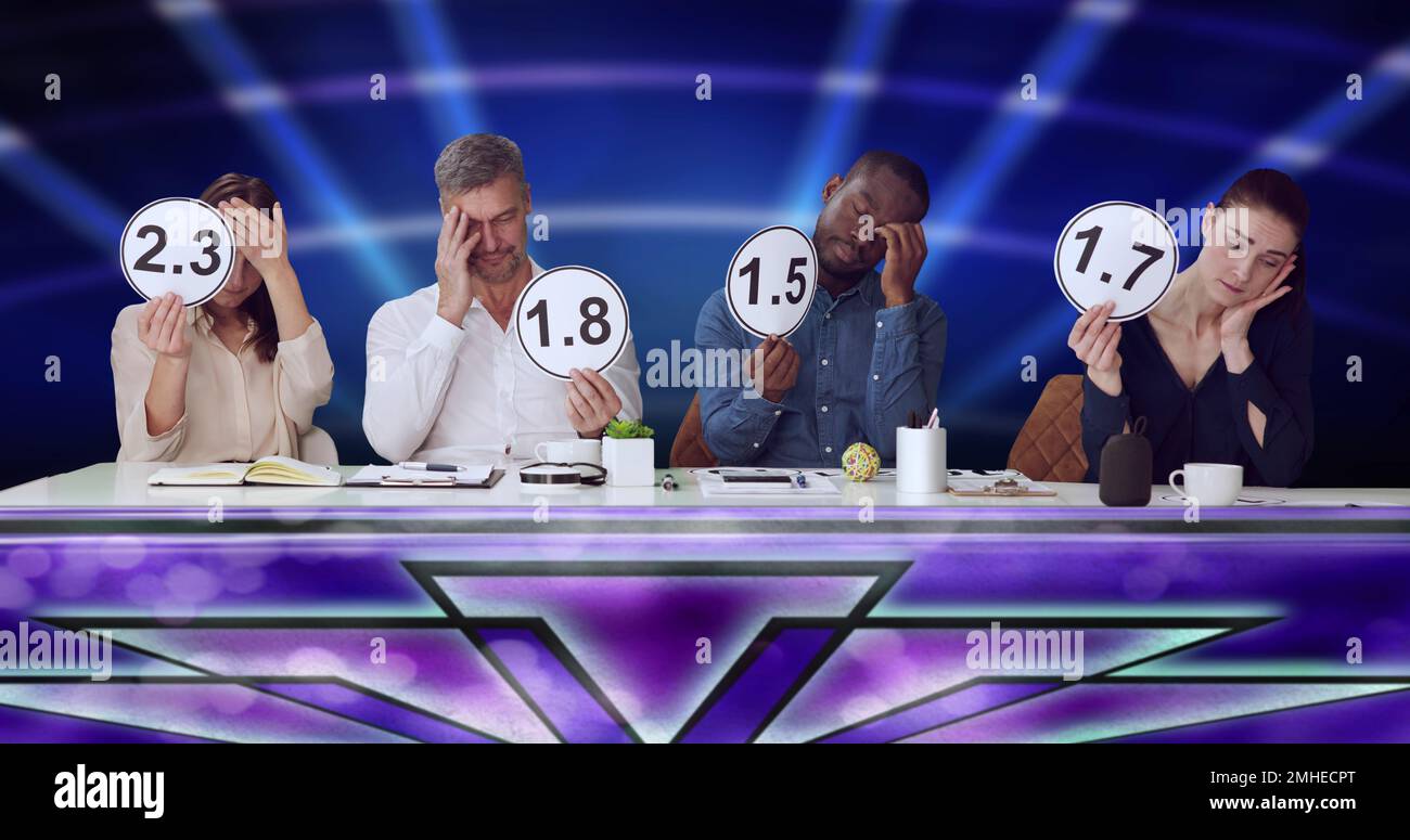 Disappointed Business People Showing Low Score Cards Sitting At Show ...