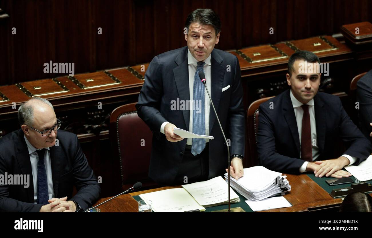 Italian Premier Giuseppe Conte, center, flanked by Economy Minister ...