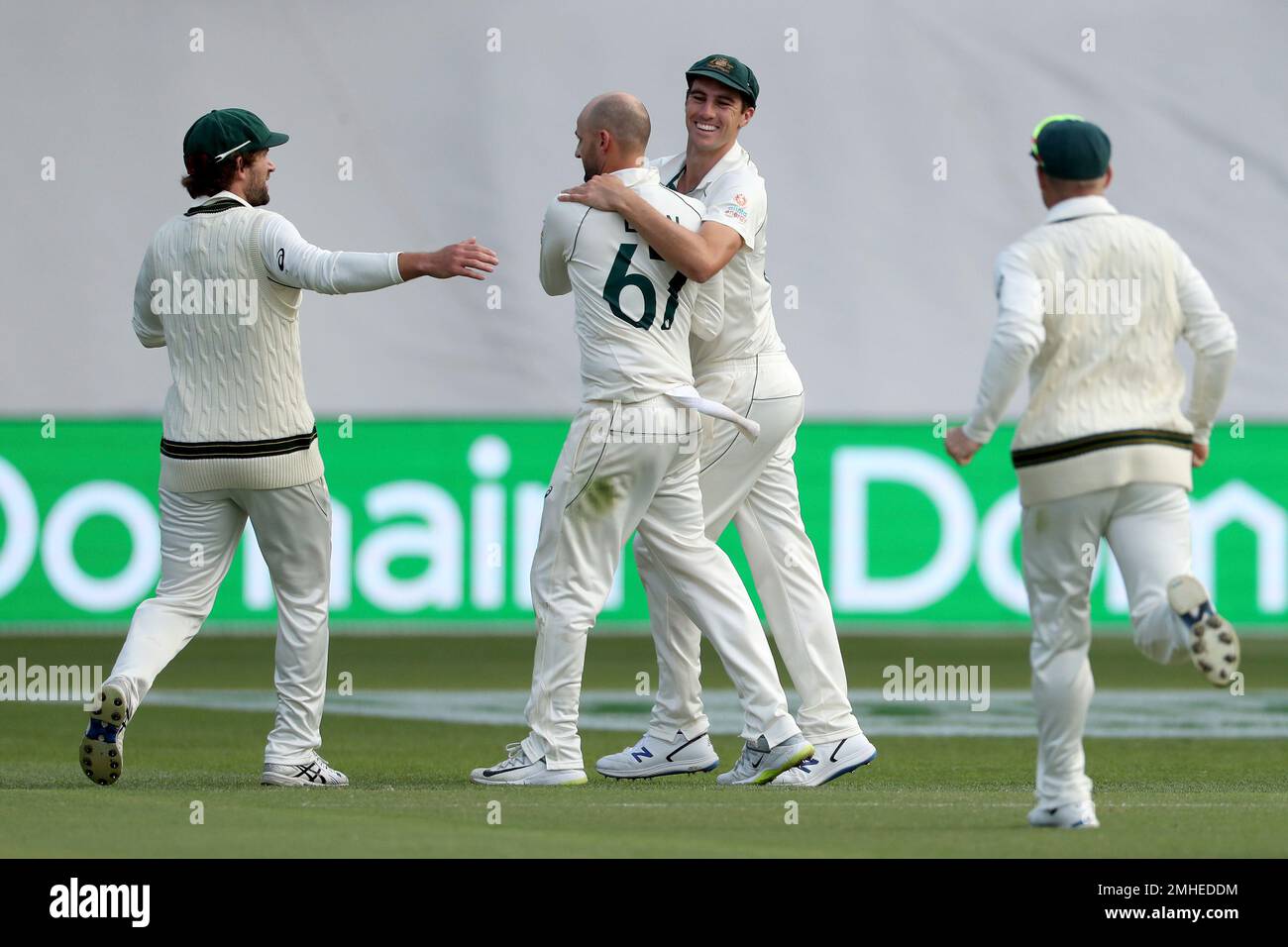 Australia's Nathan Lyon and Pat Cummins celebrate the wicket of ...