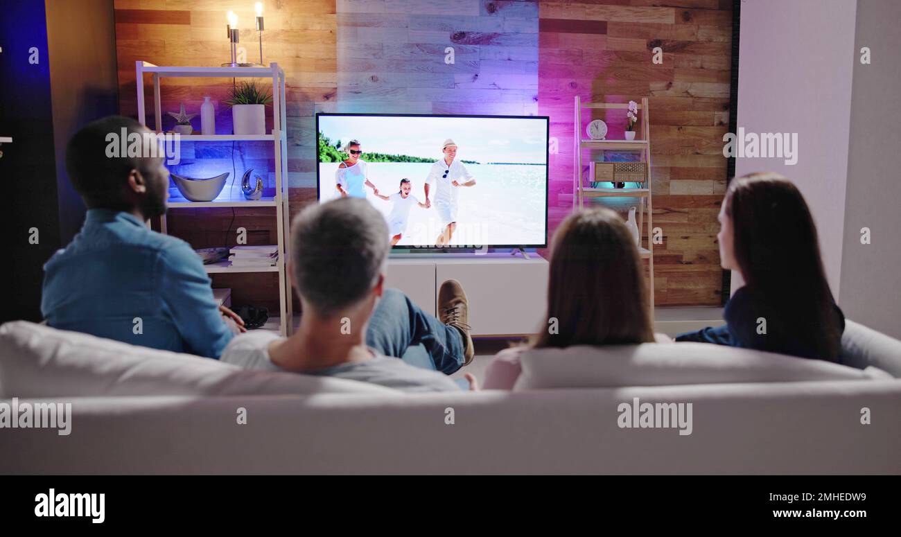 African Family Watching TV Movie On Television Stock Photo - Alamy