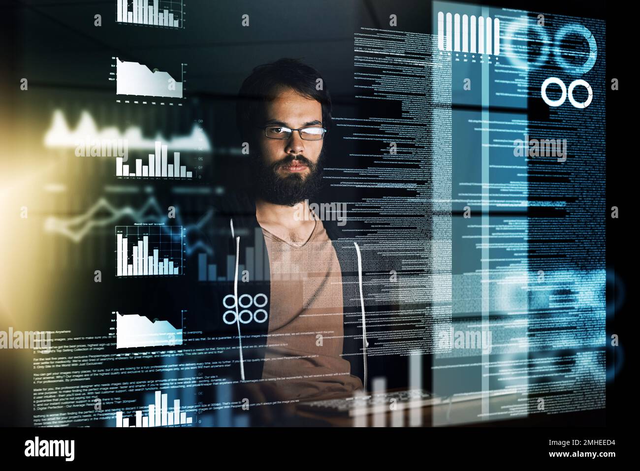 Accessing important information. a young computer programmer working on source code Stock Photo ...