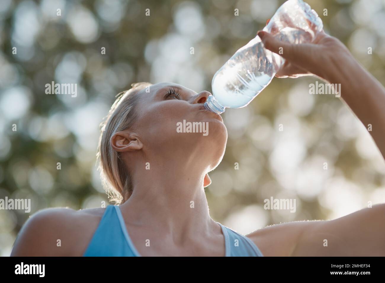 Nothing is more refreshing than water. mature and fit woman having a ...