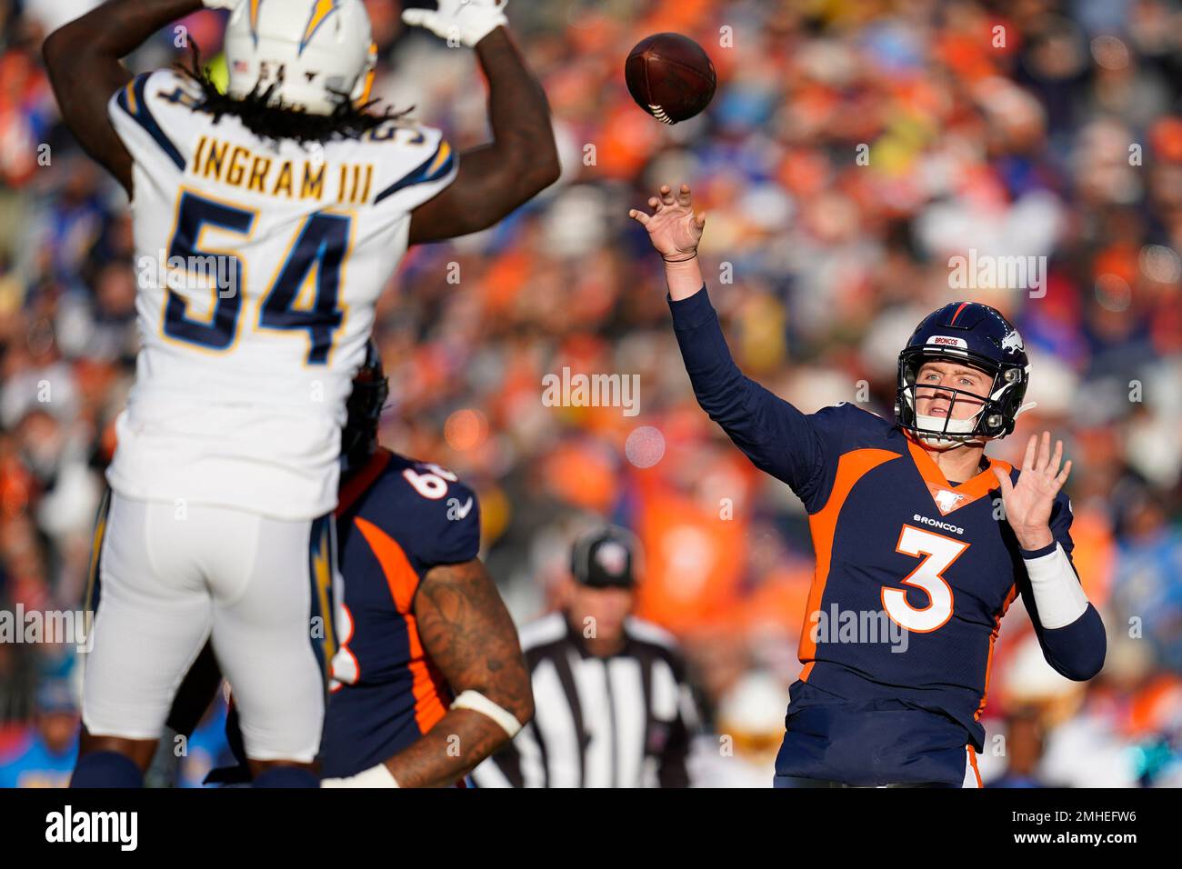Denver Broncos quarterback Drew Lock passes under pressure form Los ...