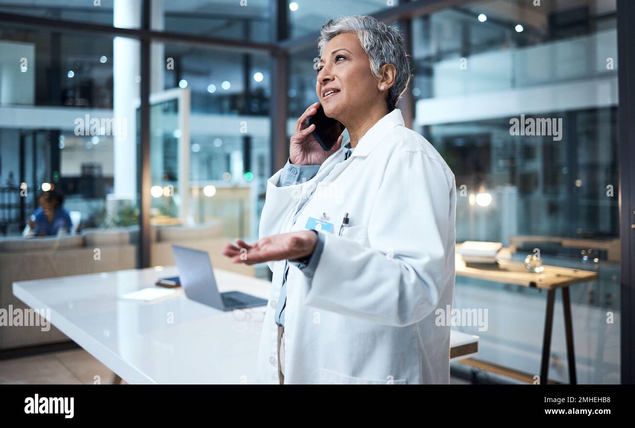 Night, woman and doctor with phone call, office and talking for ...