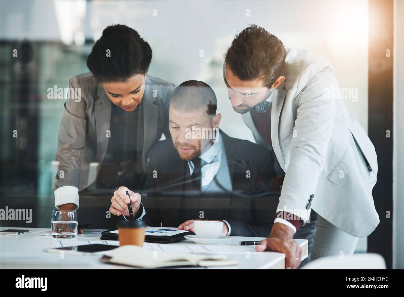 Theyre all stuck in on getting the job done. businesspeople working ...