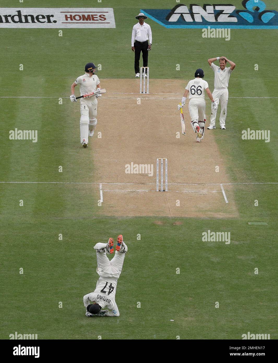 New Zealand's BJ Watling, bottom, lands on his head after attempting to ...