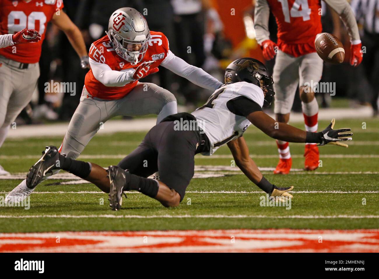 Colorado wide receiver Dimitri Stanley, right, fumbles the ball against ...