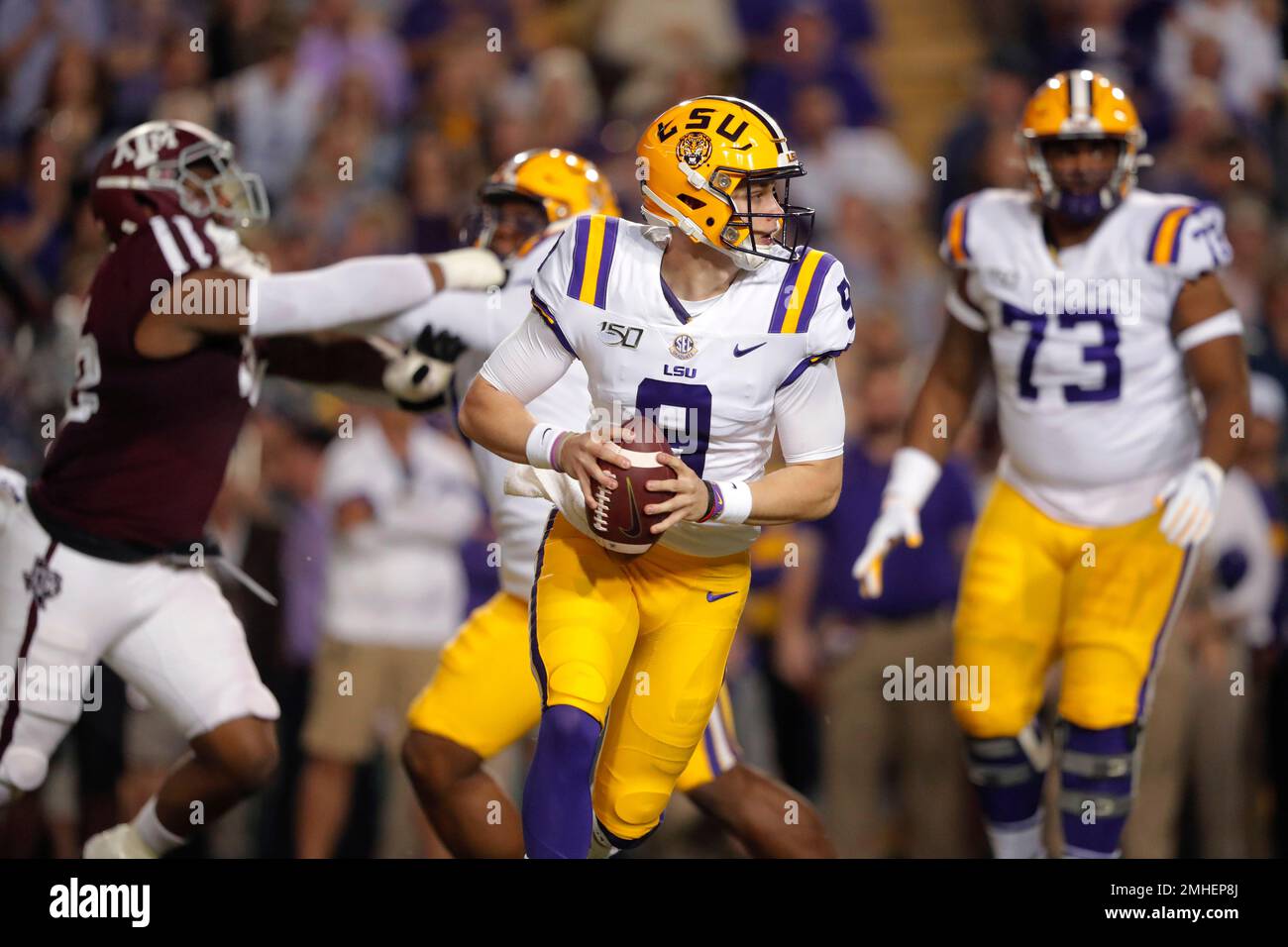 LSU quarterback Joe Burrow (9) scrambles in the first half of an NCAA ...
