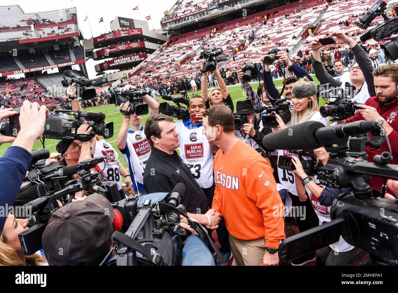 Clemson head coach Dabo Swinney, right, and South Carolina head coach ... Clemson head coach Dabo Swinney, right, and South Carolina head coach ...