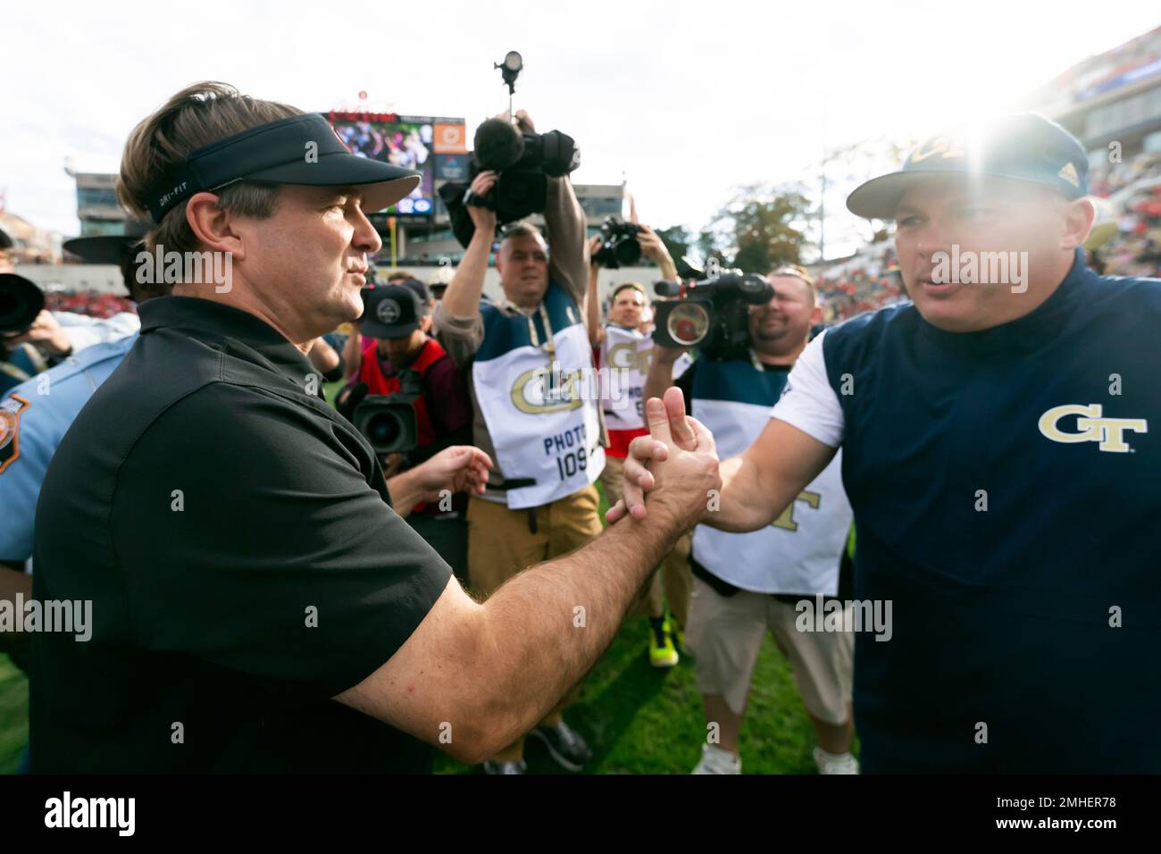 Georgia coach Kirby Smart, left, greets Georgia Tech coach Geoff ...