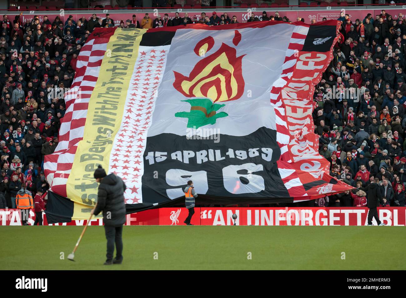 Fans hold up a tribute to the victims of the Hillsborough disaster ...