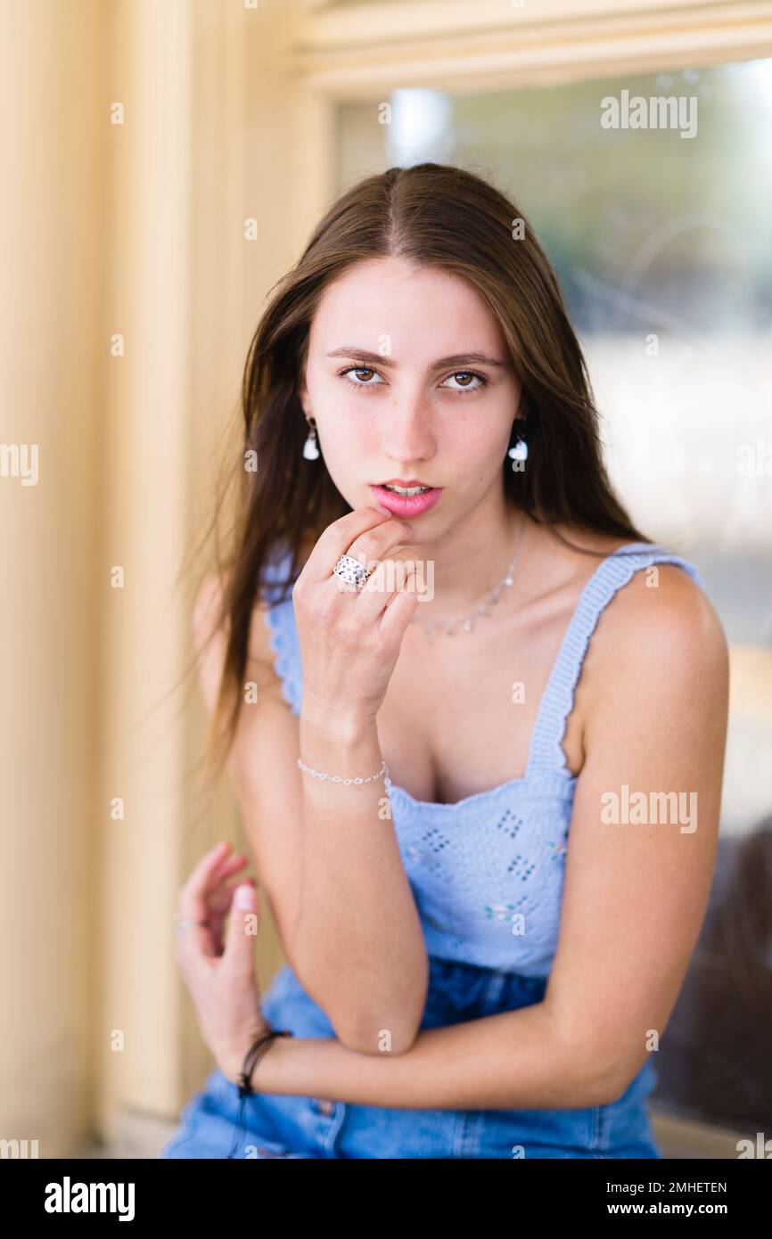 Half Body Teenage Girl Seated Touching Lips with Fingers Thoughtfully ...